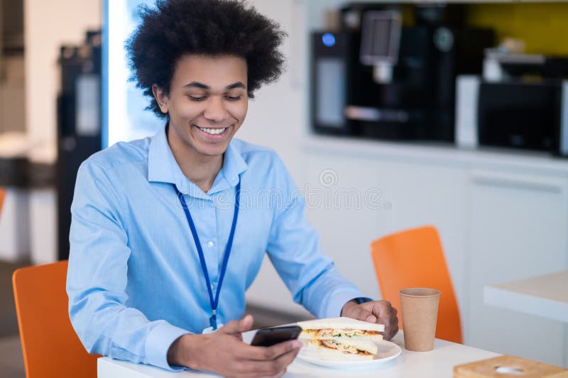 Man Feeling Hungry Enjoying Snack while Browsing Internet on His ...