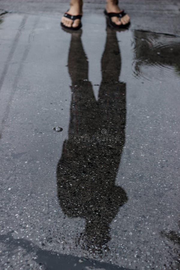 Man Feet And Reflection Water. Stock Photo - Image of shadow, puddle ...