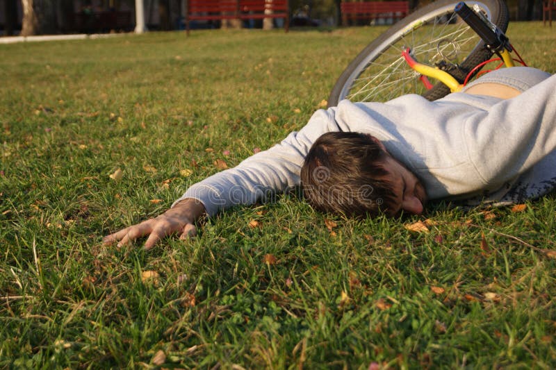 Man Fell Off the Bike in the Park Stock Image - Image of bike ...