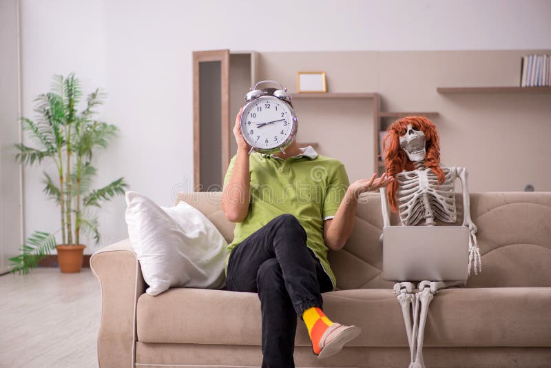 Young Man with Female Skeleton in Time Management Concept Stock Image ...