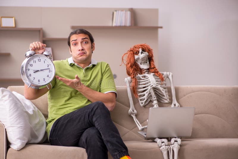 Young Man with Female Skeleton in Time Management Concept Stock Image ...