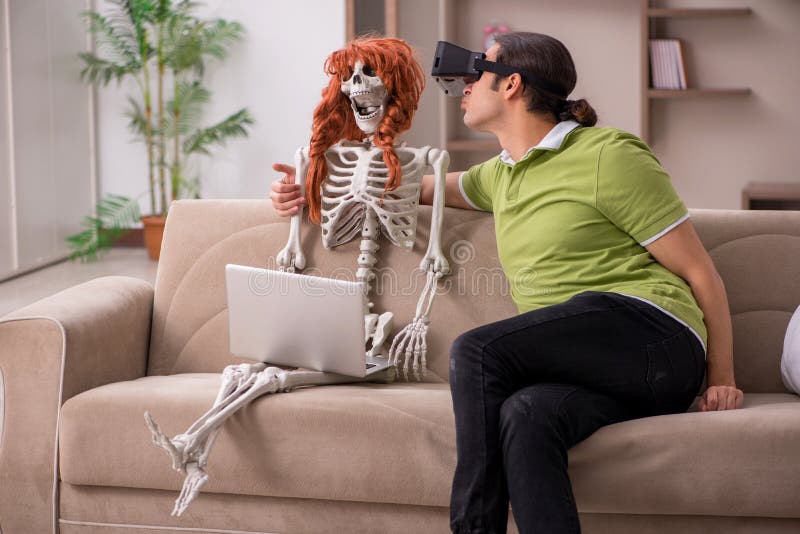 Young Man with Female Skeleton in Virtual Reality Concept Stock Photo ...