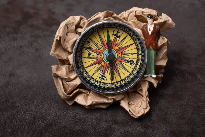 Man Figurine beside Compass As a Concept of Traveling Stock Photo ...