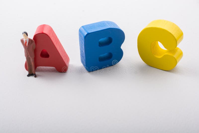 Man Figurine and Letters of Abc on White Stock Photo - Image of ...