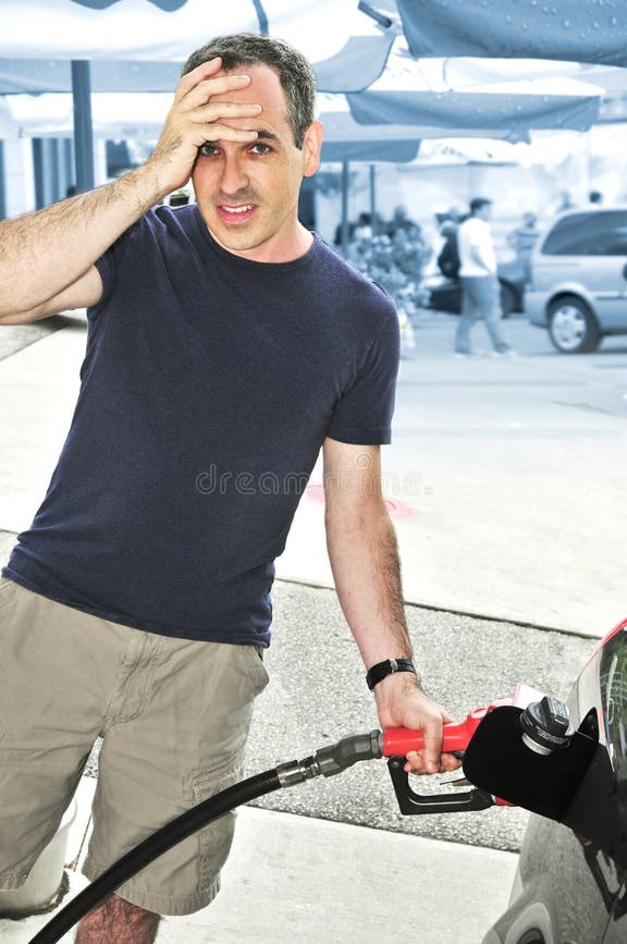 Man filling up a car stock photo. Image of disaster, nozzle - 6218208