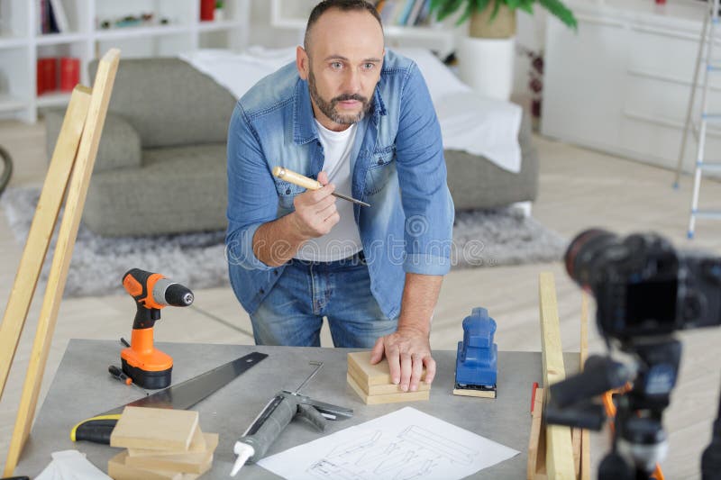 Man filming diy tutorial stock photo. Image of home - 295425424