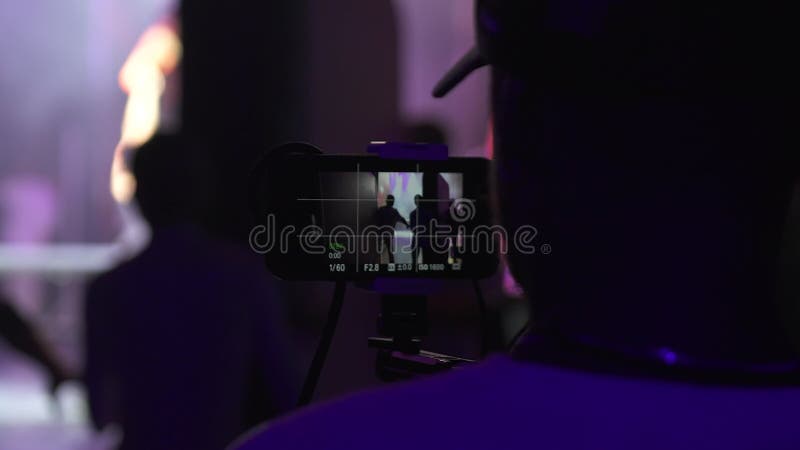Man Filming Show while Standing Backstage during Performance Stock ...