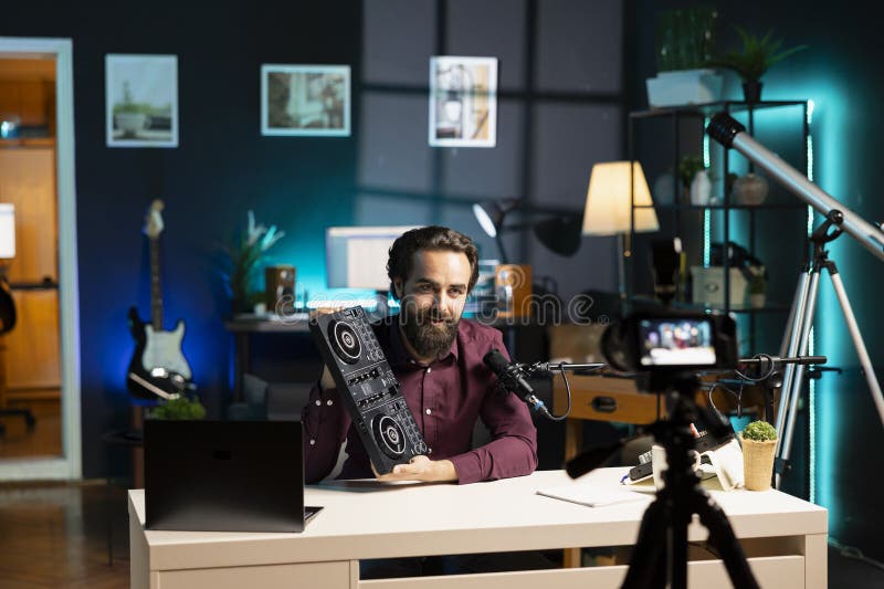 Man Filming Technology Review of DJ Controller Using Professional ...