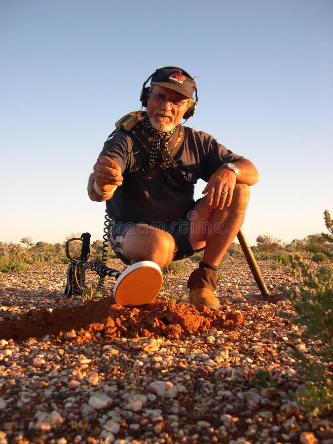 Man finding a gold nugget editorial stock image. Image of precious ...