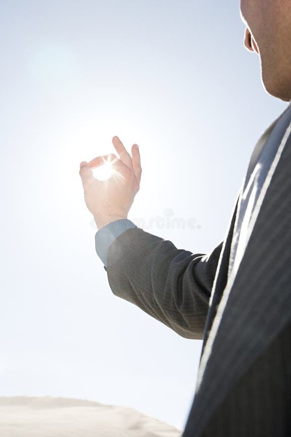 Man with Fingers Around Sunlight Stock Image - Image of dune ...