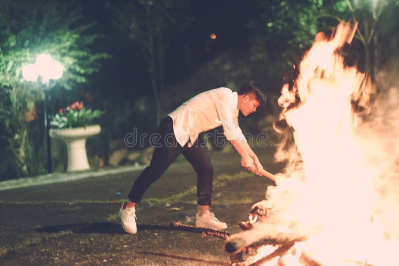 Man Beside Fire Picture. Image: 113907812