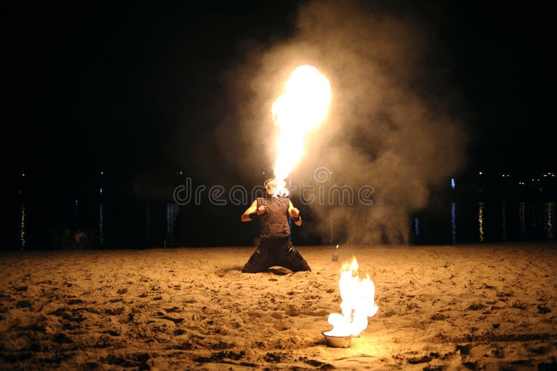 Man Fire Juggler Performing at Night on a Sandy Beach Stock Image ...