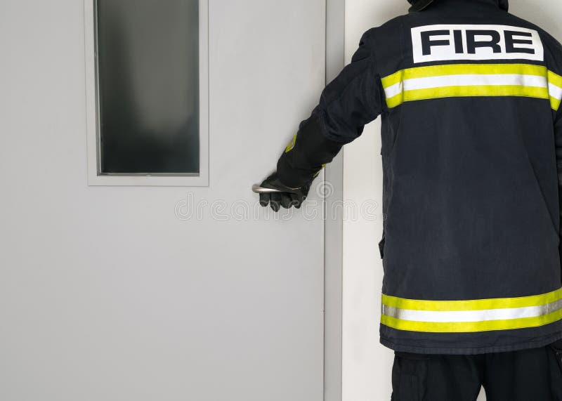 A Man in a Fireman`s Uniform Opens the Door, Rear View Stock Image ...