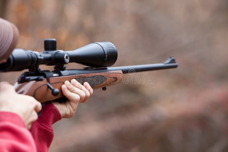 Man Firing a Rifle stock image. Image of firearm, recreation - 11956353