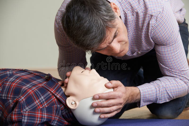 Man in First Aid Class Performing Mouth To Mouth Resuscitation O Stock ...