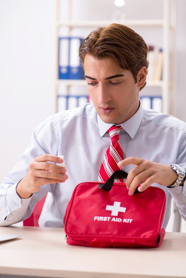The Man with First Aid Kit in the Office Stock Image - Image of ...