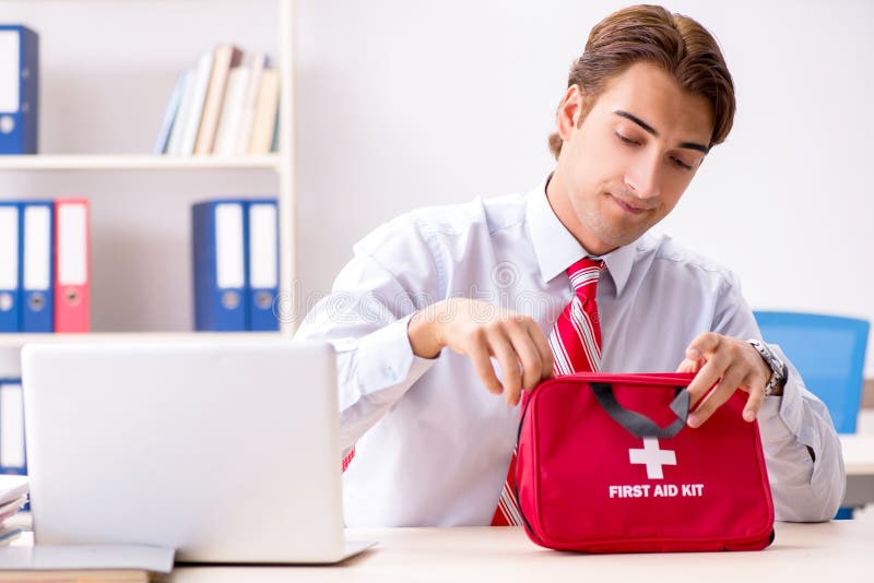 The Man with First Aid Kit in the Office Stock Photo - Image of help ...