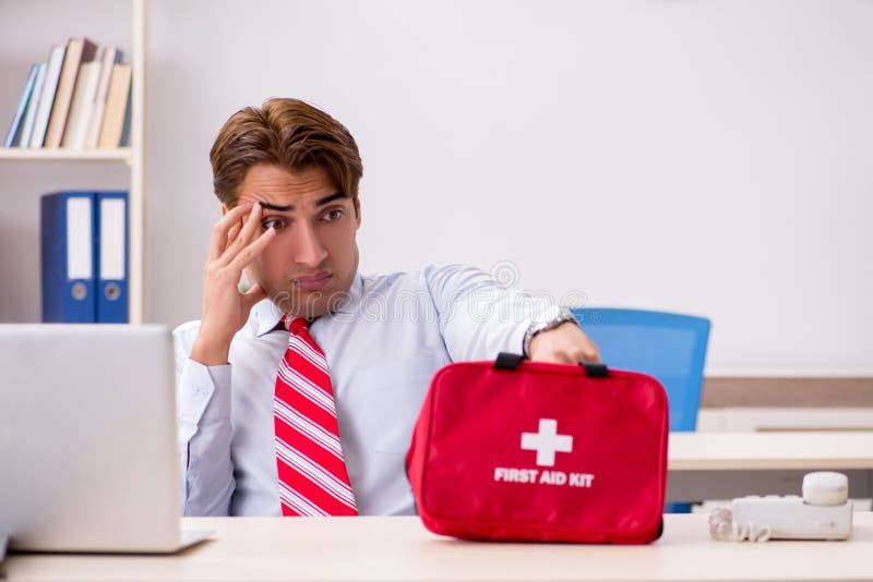 The Man with First Aid Kit in the Office Stock Photo - Image of help ...