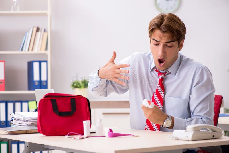 The Man with First Aid Kit in the Office Stock Photo - Image of ...
