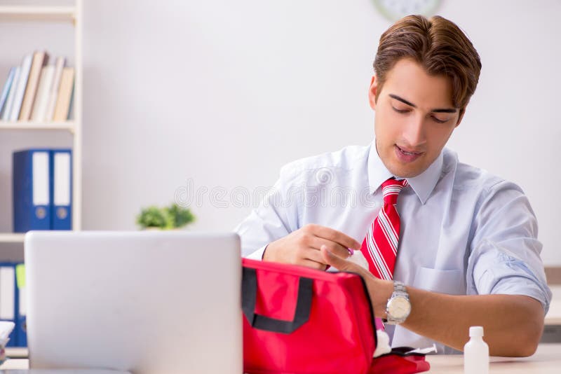 The Man with First Aid Kit in the Office Stock Image - Image of manager ...