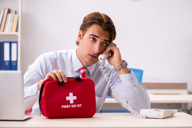 The Man with First Aid Kit in the Office Stock Photo - Image of office ...
