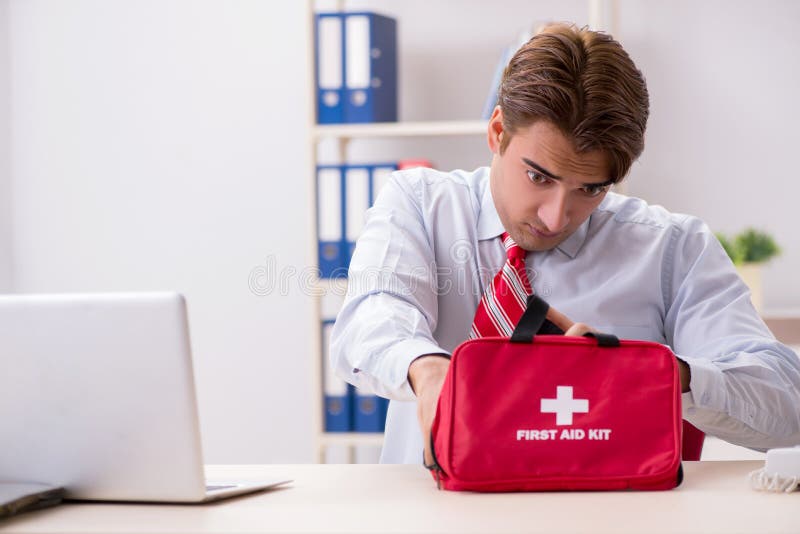 The Man with First Aid Kit in the Office Stock Photo - Image of ...