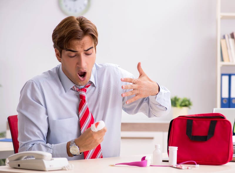 Man with First Aid Kit in the Office Stock Photo - Image of medicine ...