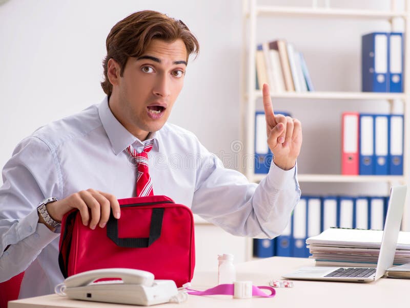 The Man with First Aid Kit in the Office Stock Photo - Image of ...