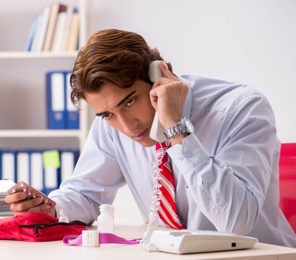 Man with First Aid Kit in the Office Stock Photo - Image of computer ...