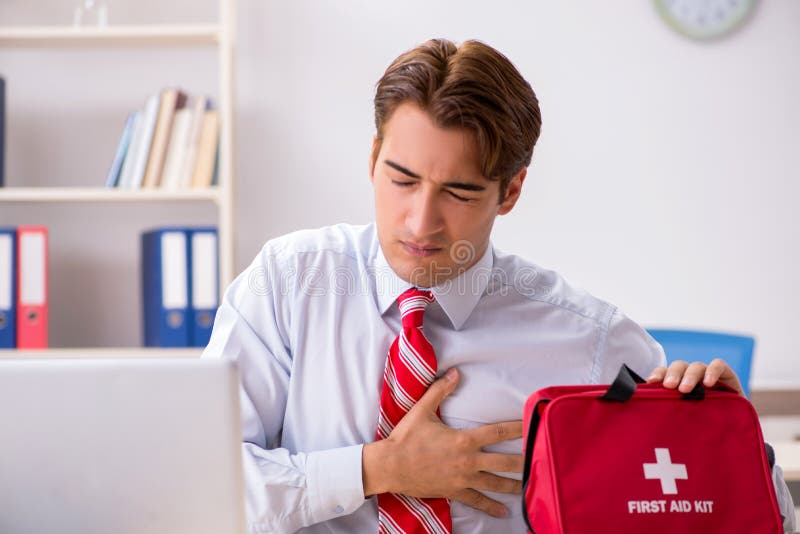 The Man with First Aid Kit in the Office Stock Photo - Image of ...