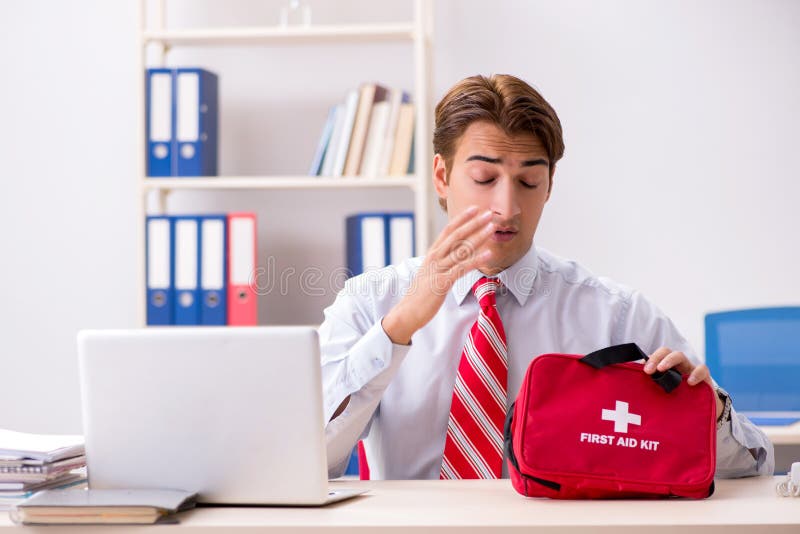 The Man with First Aid Kit in the Office Stock Photo - Image of ...