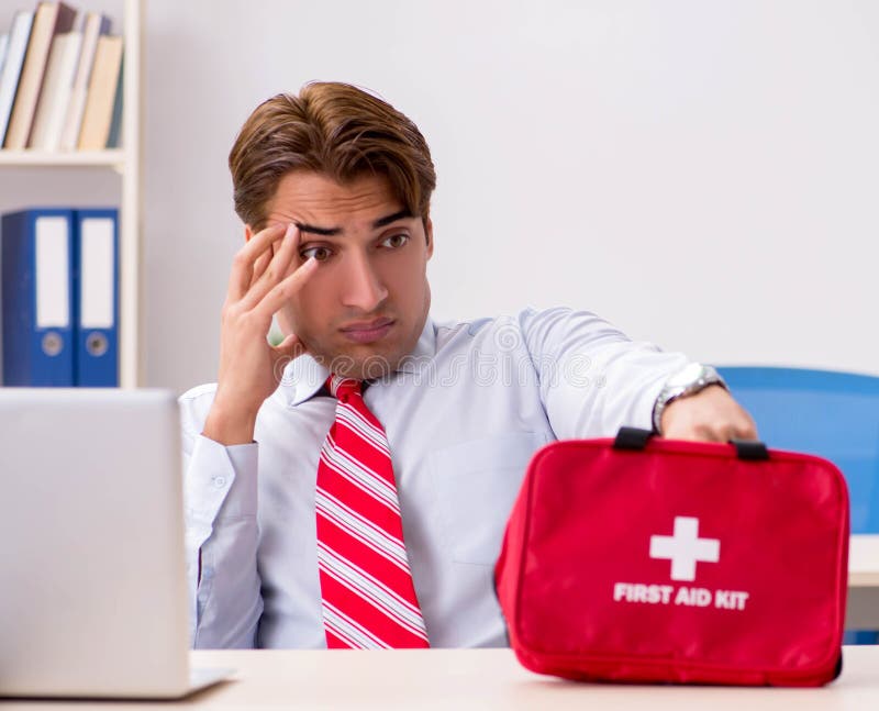 Man with First Aid Kit in the Office Stock Image - Image of cross, desk ...