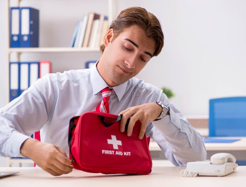 Man with First Aid Kit in the Office Stock Photo - Image of accident ...