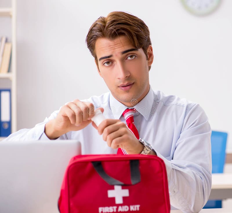 Man with First Aid Kit in the Office Stock Image - Image of accident ...