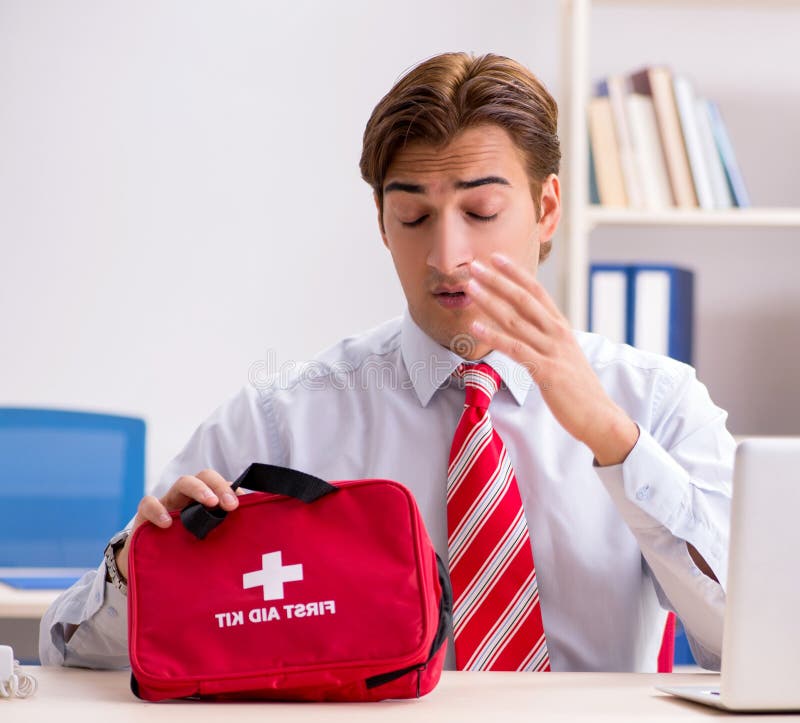 The Man with First Aid Kit in the Office Stock Photo - Image of ...