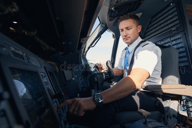 Man First Officer Pressing Button on Airplane Control Panel Stock Image ...