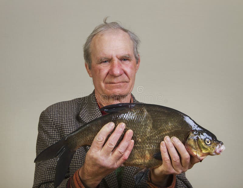 Man and fish. stock image. Image of holding, studio, blood - 51107341