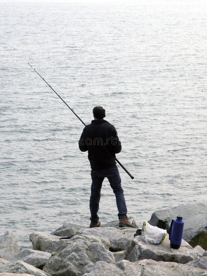 Man fishing stock photo. Image of relaxing, fishing, coast - 101338