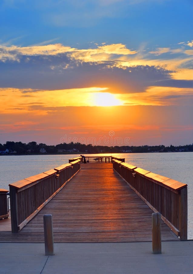 Man Fishing on Pier at Sunset Stock Image - Image of clouds, outdoors ...