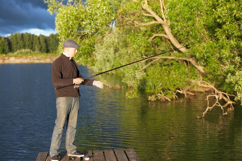 Man fishing in a pond stock photo. Image of float, male - 42941358