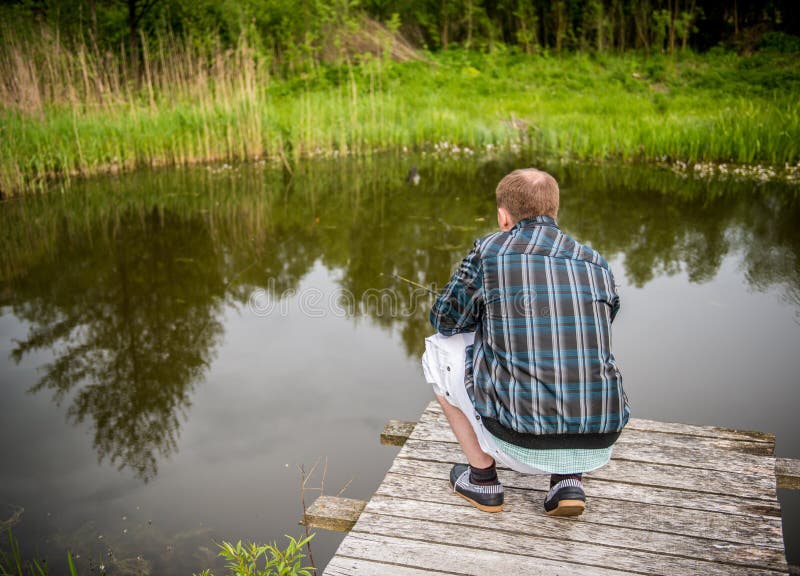 Man fishing stock photo. Image of fisherman, water, tree - 69485264