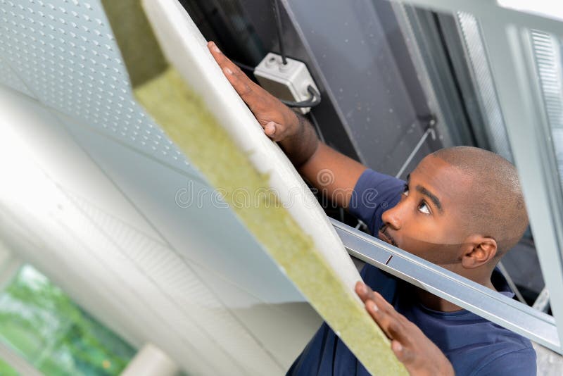 Man fitting ceiling panel stock image. Image of black - 309077873