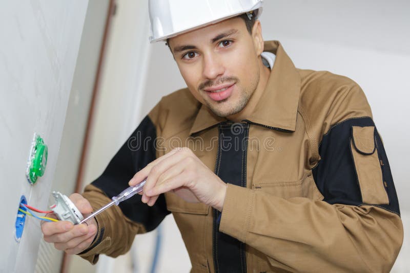 Man Fitting Electrical Outlet in Bathroom Stock Photo - Image of ...