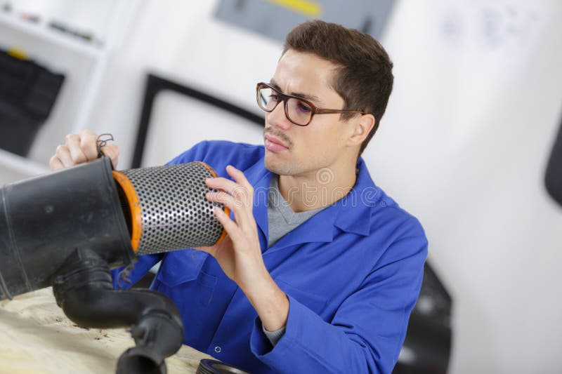 Man Fitting Filter into Plastic Tube Stock Photo - Image of insert ...