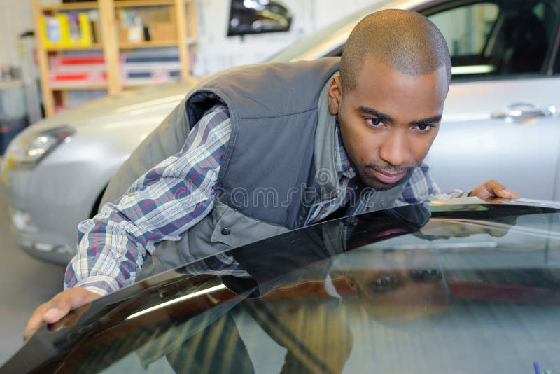 Man fitting glass frame stock image. Image of fragile - 206330749