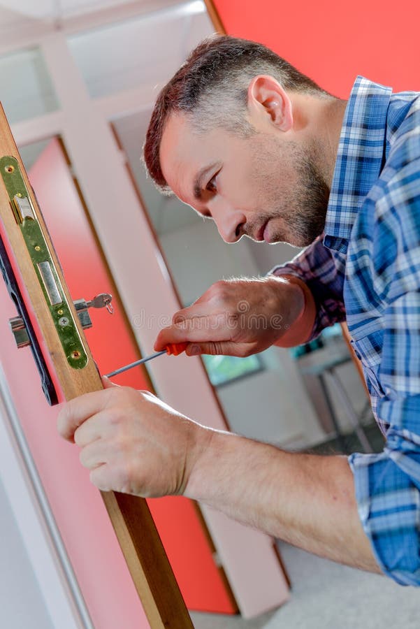 Man Fitting Lock To Interior Door Stock Image - Image of fire, closeup ...