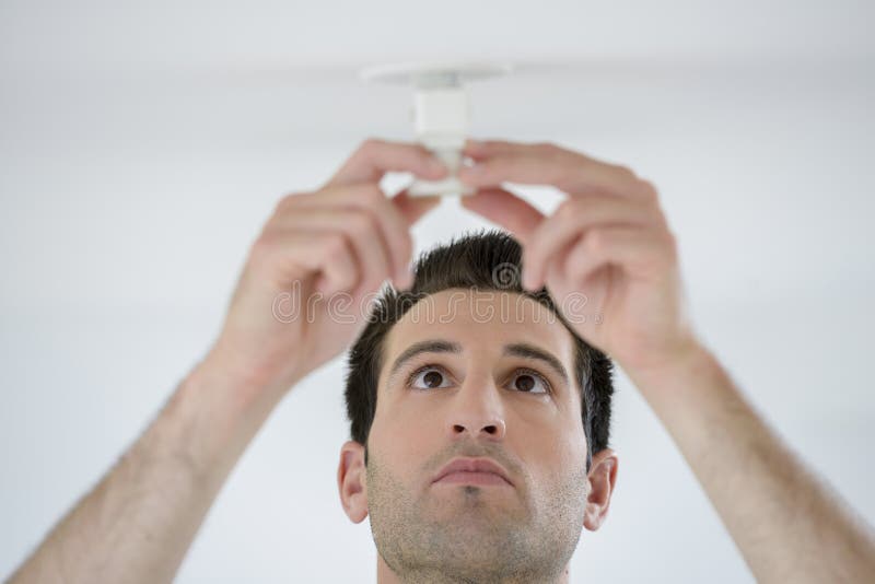 Man Fitting Spotlight in Ceiling Stock Image - Image of bulb ...