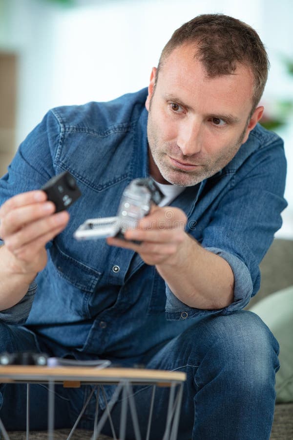 Man Fitting Water Proof Case To Gopro Stock Photo - Image of standing ...