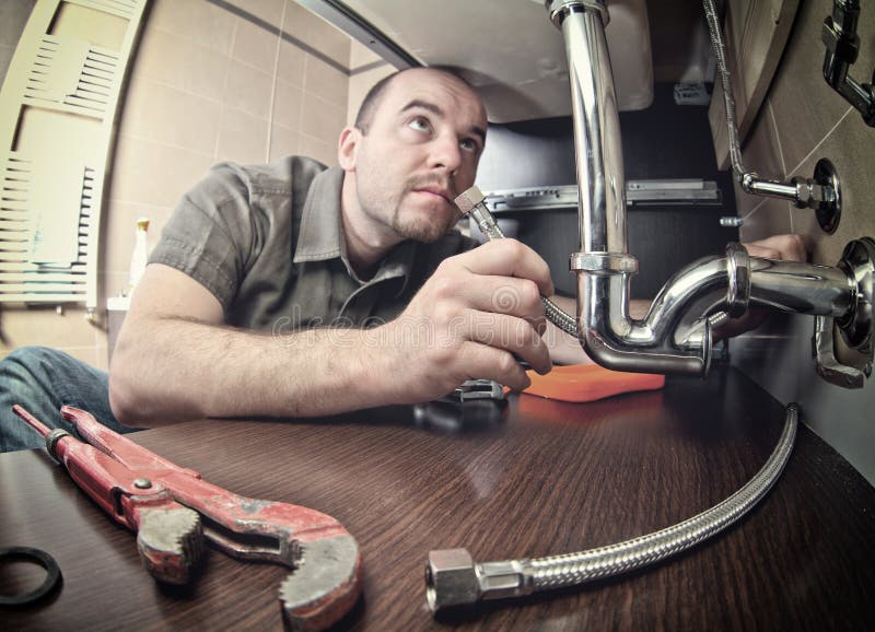 Man fix pipe stock image. Image of handsome, pipe, male - 24803931