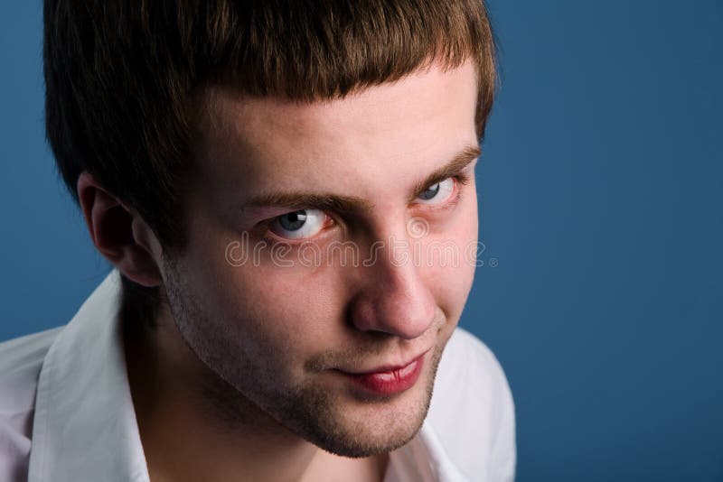 Man With Fixed Look Over Blue Background Stock Image - Image of ...